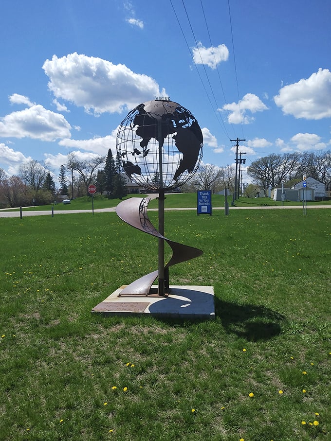 The world at your feet &ndash; literally! This globe sculpture proves Vining's got the whole world in its hands.