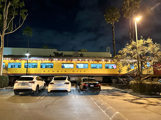 By day, a parking lot. By night, a beacon of hope for hungry night owls. The Bat-Signal has nothing on this glowing train.