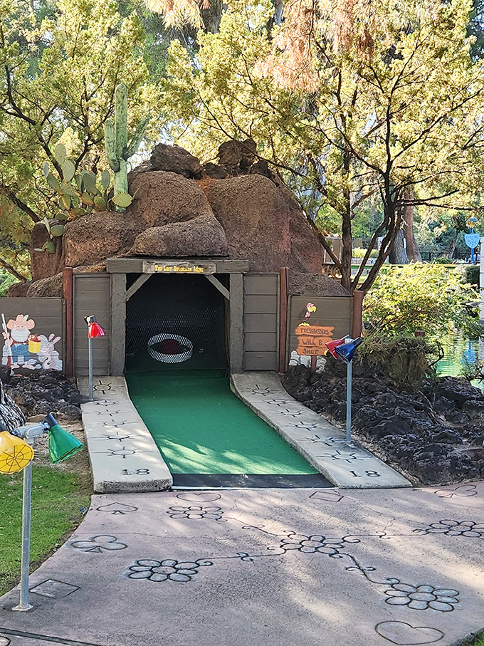 Follow the floral-paved road! This charming path, adorned with painted blooms, leads you through a garden of golfing delights.