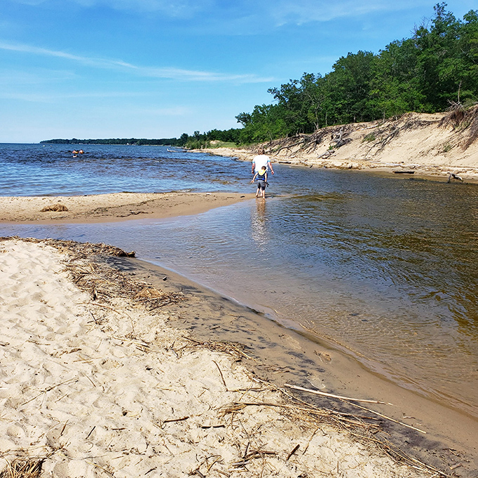 Walk on water, Michigan-style! This sandbar invites visitors to venture into Lake Huron's refreshing embrace.