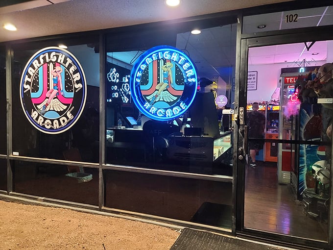 The bat-signal for gamers! Starfighters Arcade's neon sign beckons, promising a night of bleeps, bloops, and nostalgic bliss.