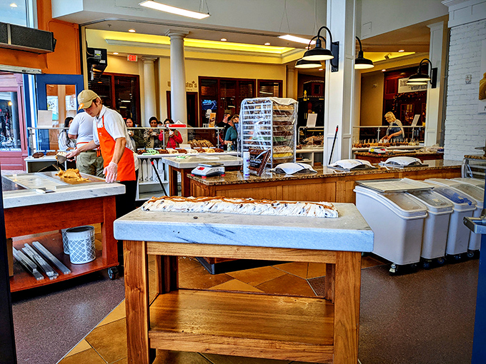 Fudge whisperers at work! These skilled artisans are the Michelangelos of the confectionery world, sculpting sweet masterpieces one paddle at a time.
