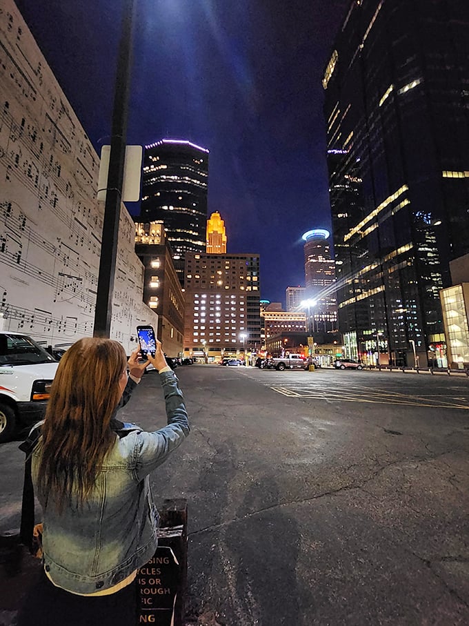 Capturing the moment or composing a masterpiece? This visitor's snapshot might just be the opening bars of a great adventure.