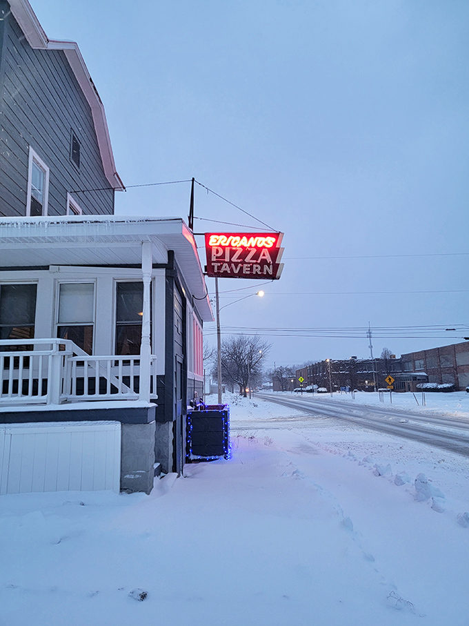 A winter wonderland of pizza! Even in the snow, Fricano's red sign shines like a beacon for hungry travelers.