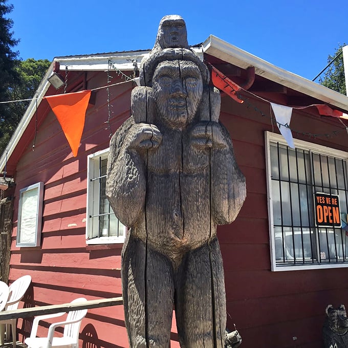 Bigfoot's artistic cousin? This wooden statue stands tall, greeting visitors with a stoic expression that says, "I've seen some things, man."