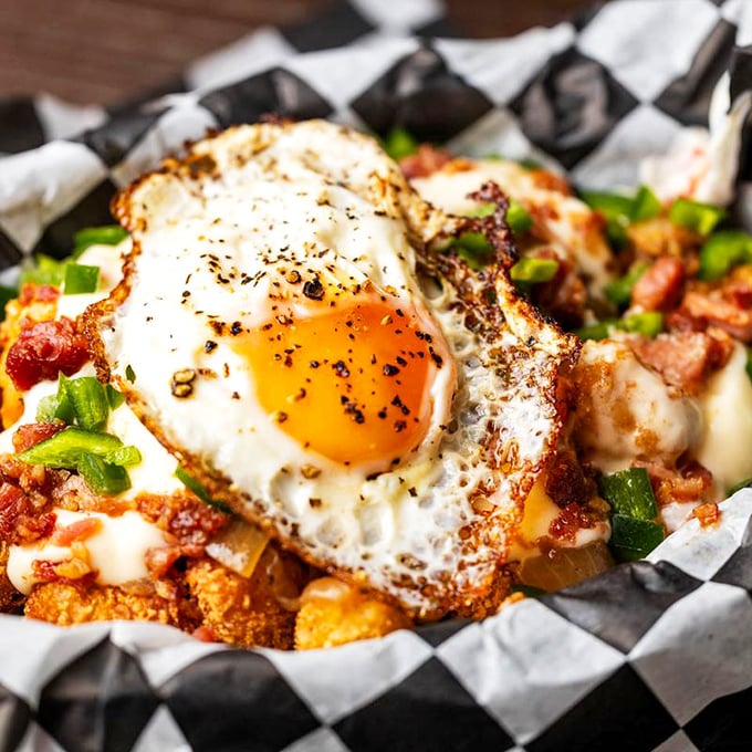 Behold the Borracho Tots &ndash; where potatoes go to fulfill their destiny. Topped with a sunny-side-up egg, it's breakfast's rebellious cousin.