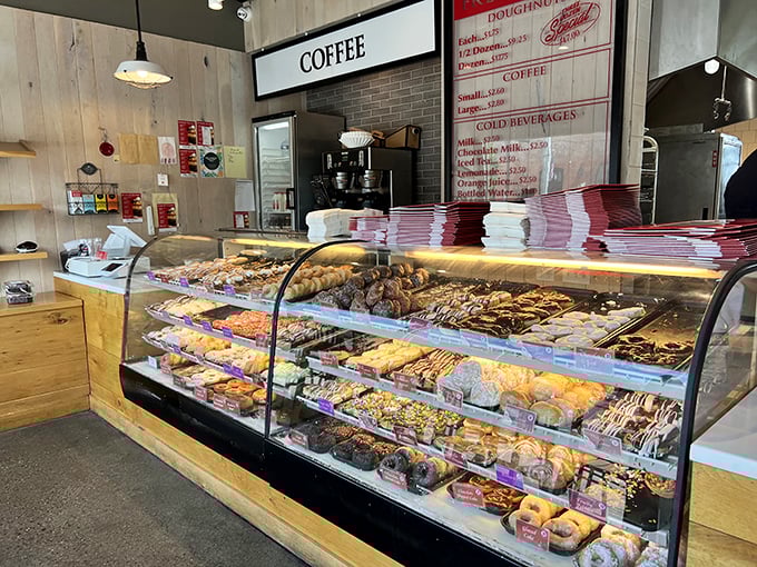 Doughnut heaven on display! This case is like a museum of mouthwatering masterpieces. Art has never been so deliciously accessible.
