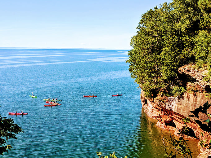 Kayaking through nature's cathedral. These red cliffs are giving the Grand Canyon a run for its money in the "jaw-dropping scenery" department.