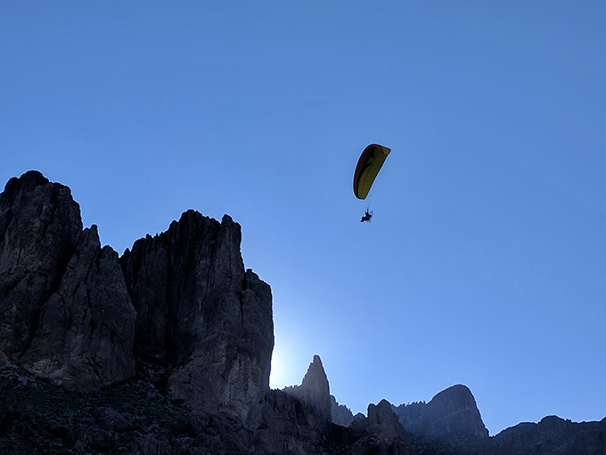 Look, up in the sky! It's a bird, it's a plane... it's a daredevil paraglider soaring over the Superstitions. Talk about a bird's-eye view!