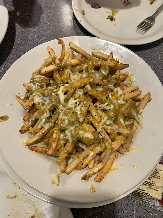 Fries that'll make you say "holy guacamole!" These pork and green chili fries are a flavor fiesta that'll have your taste buds dancing the salsa.