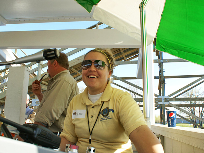 The captain of coaster fun! This operator's smile says, "Buckle up, buttercup &ndash; you're in for the ride of your life!"