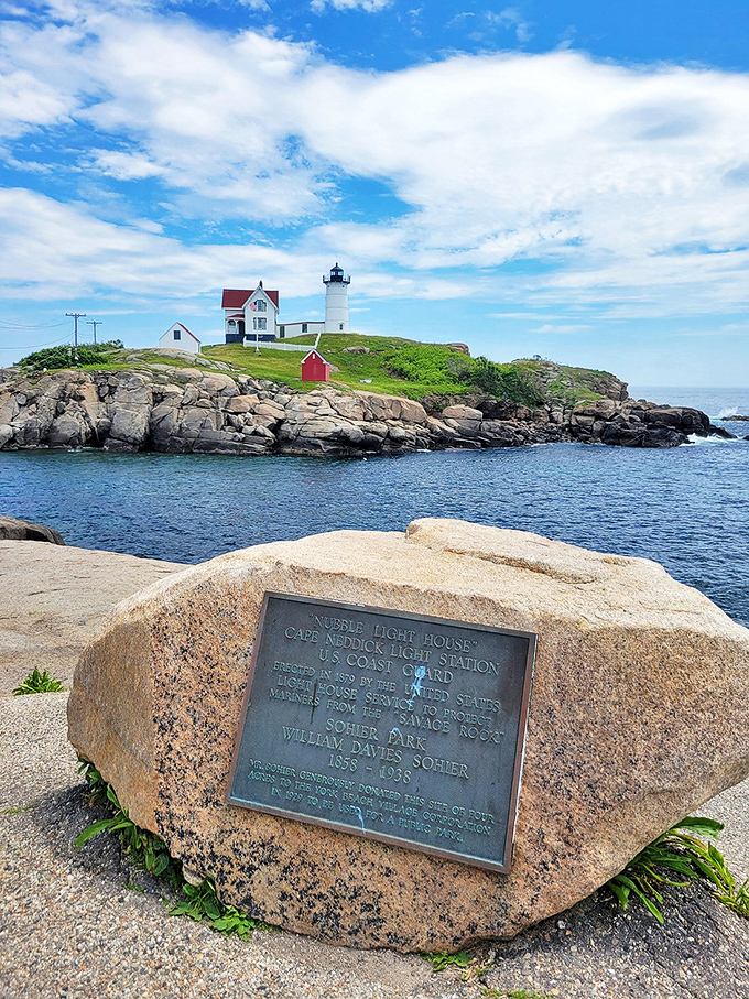 A lighthouse, a plaque, and thou. This view is serving up a history lesson with a side of breathtaking scenery.
