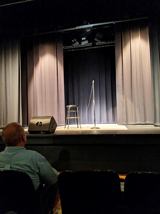 The stage is set, the mic is hot, and the audience is... well, just one guy. Must be open mic night at the Strand!