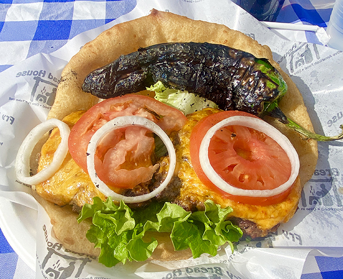 Talk about a glow-up! This isn't your average sandwich - it's a fry bread creation that's dressed to impress and ready for its close-up.