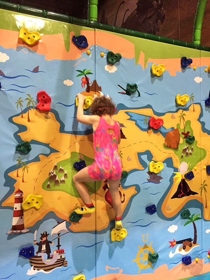 Who needs Everest when you've got this colorful climbing challenge? It's a vertical voyage through time, with each hold bringing you closer to paleontological perfection.