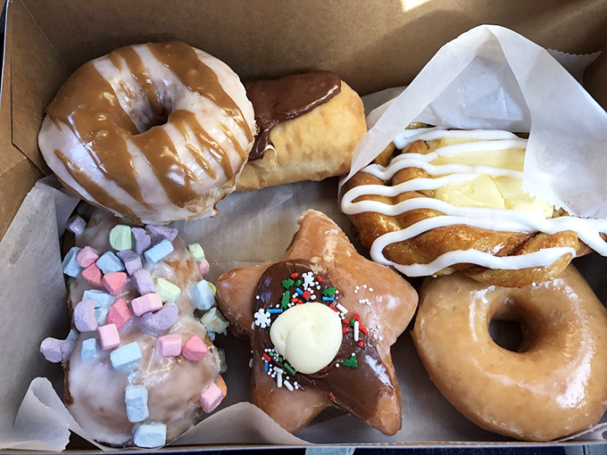A rainbow of rings! This box of assorted donuts is like edible modern art &ndash; too pretty to eat, but far too delicious not to.