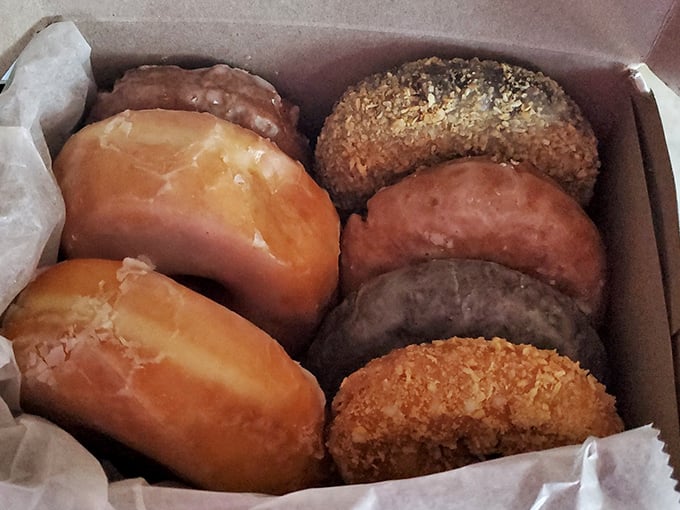 A box of possibilities! From classic glazed to adventurous flavors, each donut is a ticket to taste bud paradise.