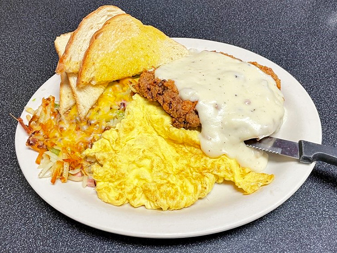 Chicken fried steak: Where 'indulgence' meets 'why not?' This plate's got more country comfort than a Kenny Rogers marathon on CMT.