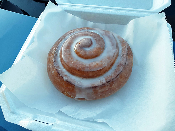 Cinnamon roll or edible hug? This spiral of sweetness is like a warm, gooey embrace for your taste buds – resistance is futile!