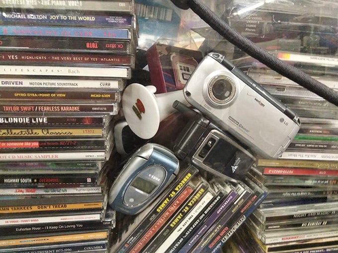 A tech time capsule meets mixtape heaven! This blast from the past is where CDs and flip phones go to reminisce about the good old days of the '90s.