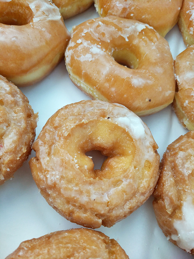 The classic glazed, elevated to an art form. These donuts are so perfect, they could make Homer Simpson weep with joy.