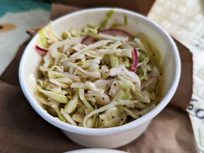 This coleslaw isn't just a side dish, it's a supporting actor gunning for a Best Side Oscar. Crunchy, fresh, and ready to cut through the richness.