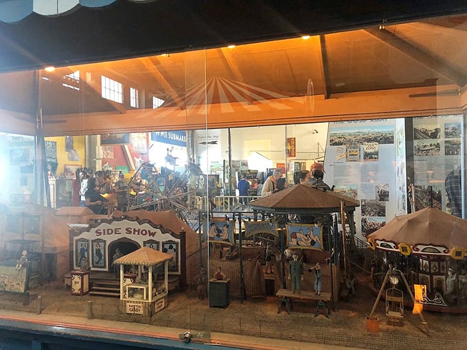 Honey, I shrunk the carnival! This miniature sideshow is like peering into a magical dollhouse where tiny carnies never sleep and the fun never stops.