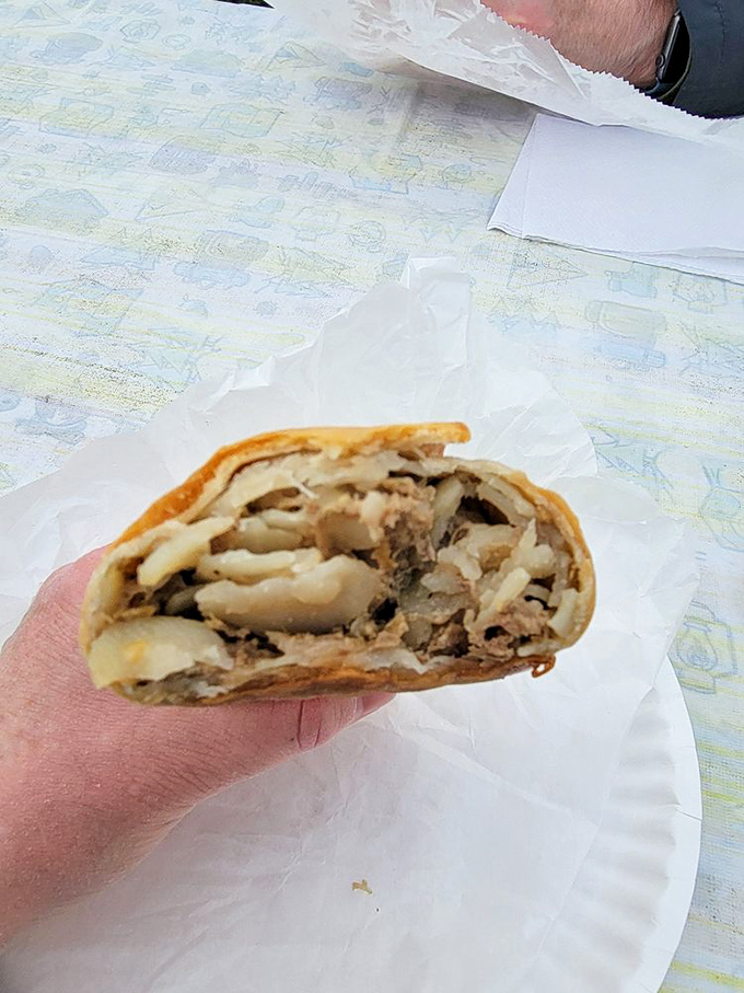 A peek inside pasty perfection. This cross-section reveals the hearty filling that's kept Yoopers happy for generations.