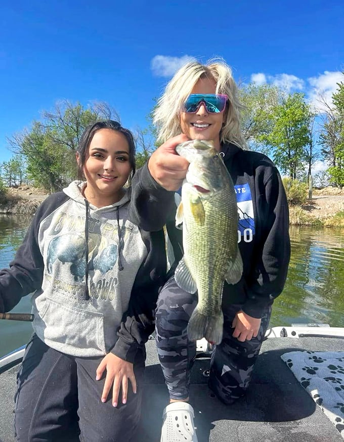 The catch of the day: These ladies are proving that fishing isn't just a tall tale – it's a real-life adventure at Sweitzer Lake. That bass looks like a keeper!