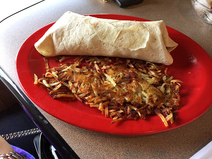 Not your average side dish! This burrito and crispy hash brown combo is like the dynamic duo of breakfast – Batman and Robin never tasted this good.