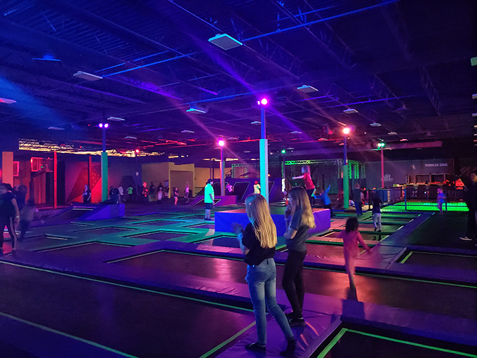 When the lights go down, the fun amps up. It's like a disco met a trampoline park and had a neon baby.