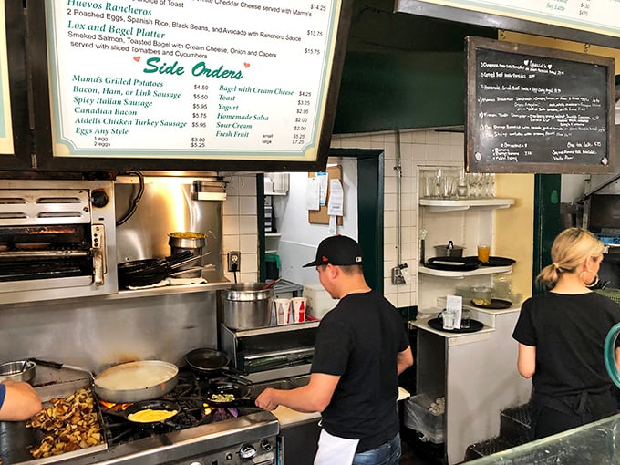 The open kitchen: where culinary magic happens. Watch in awe as the staff orchestrates your meal with the precision of a symphony.