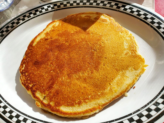 Pancakes so golden and fluffy, they could be mistaken for edible sunshine. Syrup application strongly encouraged.