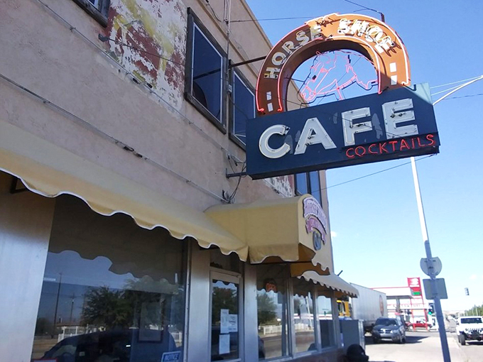 The sign says it all &ndash; cafe by day, cocktail haven by night. It's like a mullet: business in the front, party in the back!