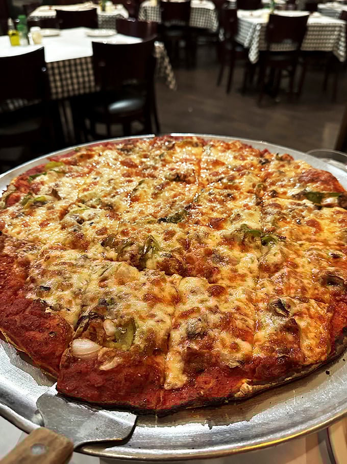 "Crispy, cheesy, and ready for its close-up." This tavern-style pizza is a true Chicago classic, proving that sometimes less really is more.