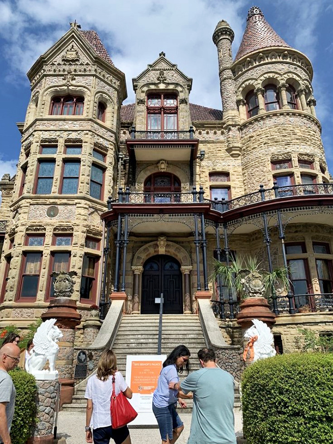 "History buffs and architecture aficionados, your mothership has landed!" Tourists gather to marvel at the Palace's stunning facade.
