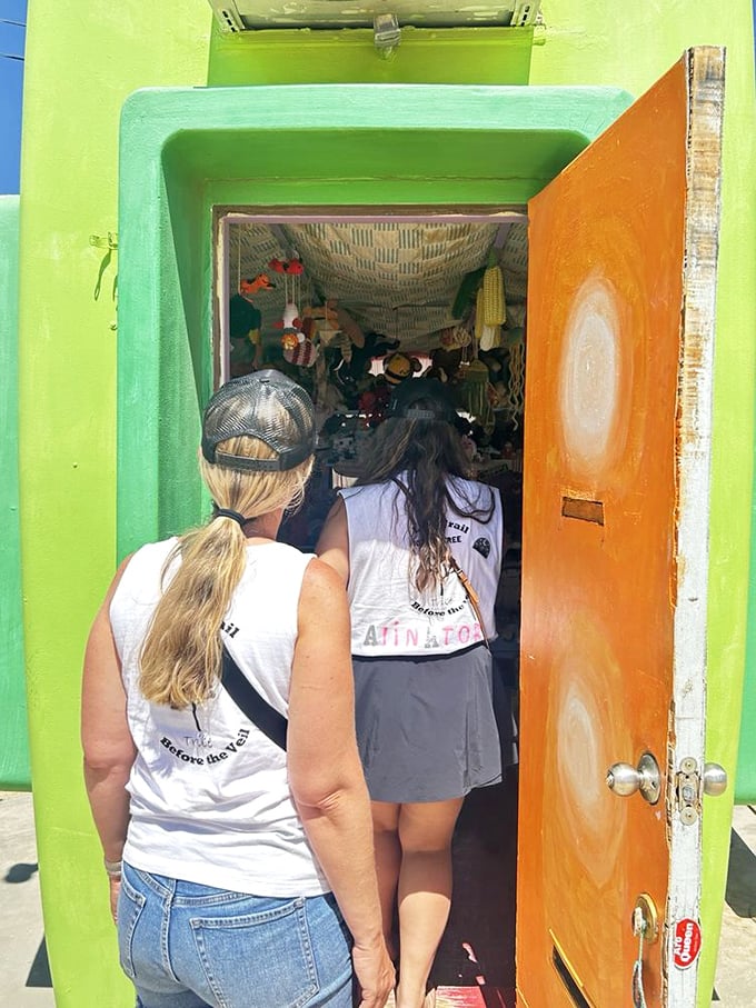 "I think we're gonna need a bigger crochet hook." Visitors squeeze into the tiny museum, proving that good things really do come in small packages.
