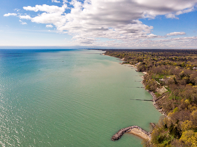 Lake Michigan's grand reveal! From up here, you can almost hear the lake whispering, "Who needs oceans anyway?"