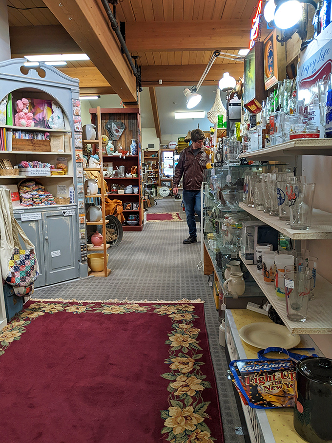 Treasure hunting in progress! This intrepid explorer navigates aisles of history, proving that one person's old stuff is another's gold mine.