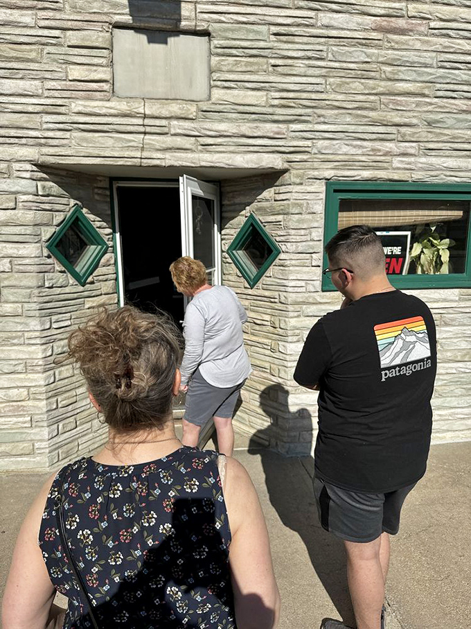 Line of anticipation! These eager customers know that good things come to those who wait – especially when donuts are involved.