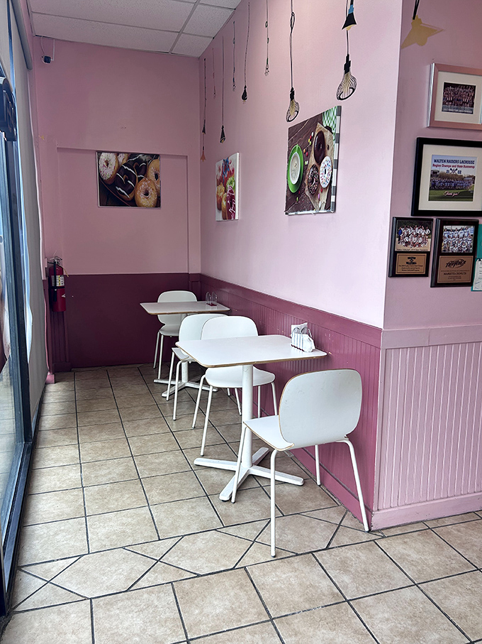 Pink walls, comfy chairs, and donut-themed art &ndash; it's like your cool aunt decorated a caf&eacute; just for you!