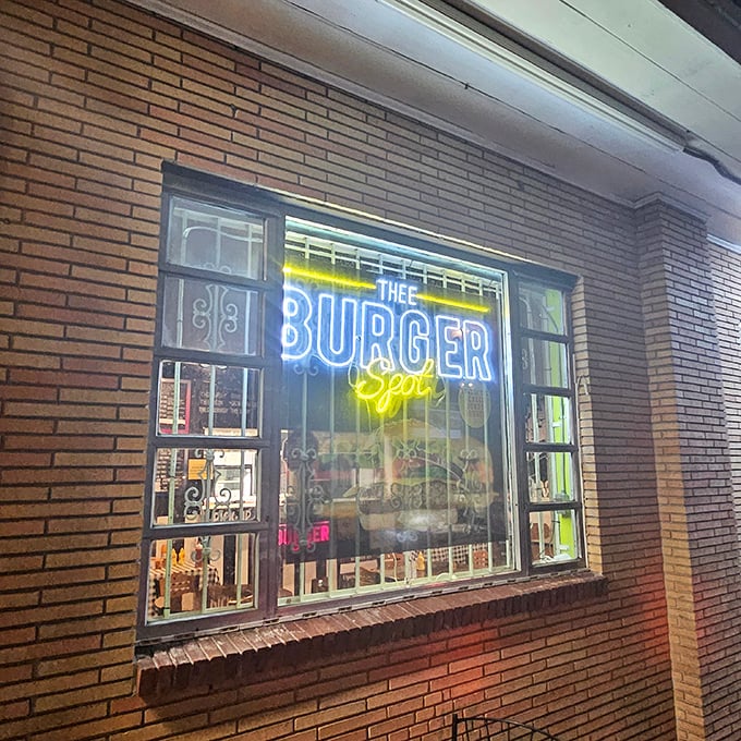 Neon dreams and burger schemes! This sign is like a beacon of hope for hungry souls in search of the perfect patty.