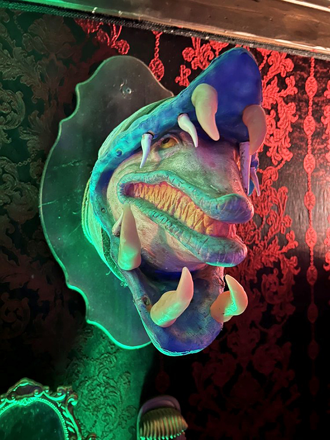 Sandworms and red wallpaper and neon, oh my! This corner of Beetle House is like a fever dream from Beetlejuice himself.