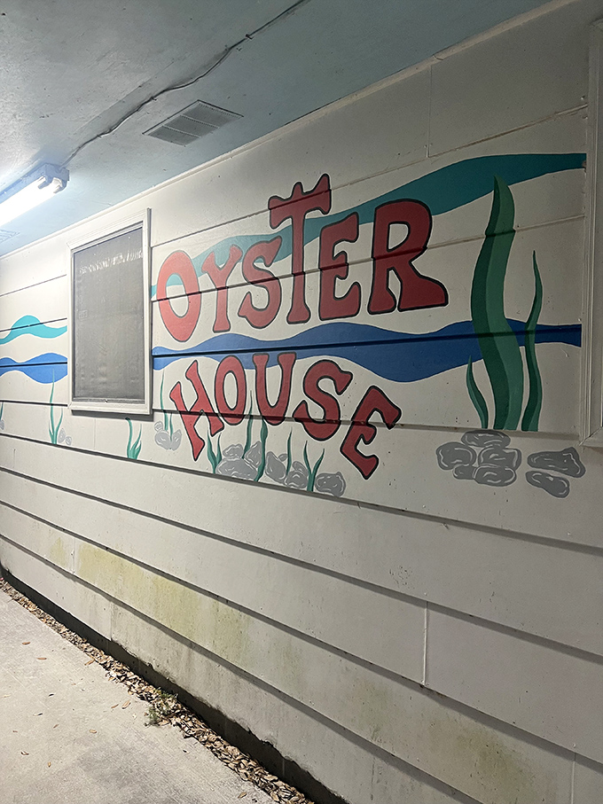 Who needs fancy signage when you've got charm? This hand-painted mural is as inviting as a cool breeze on a hot Florida day.