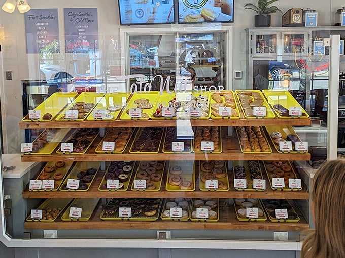 Donut heaven awaits! This display case is a work of art that would make even the Mona Lisa smile. Sweet temptation, anyone?