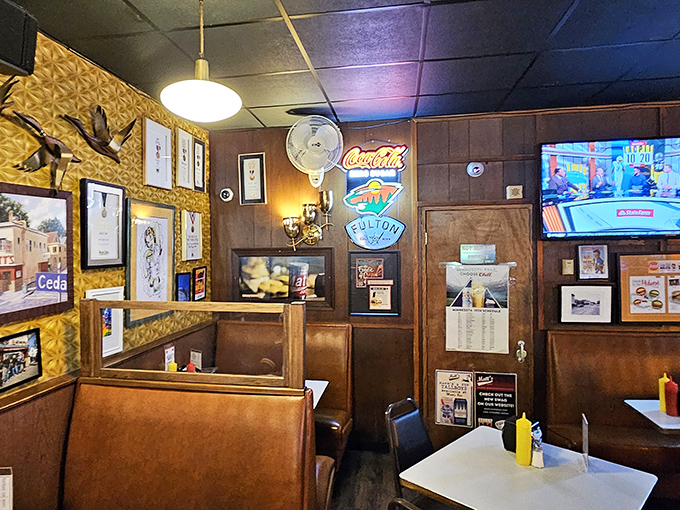 A wall of fame and flavor! Each picture tells a tale, but the aroma in the air? That's the real story.