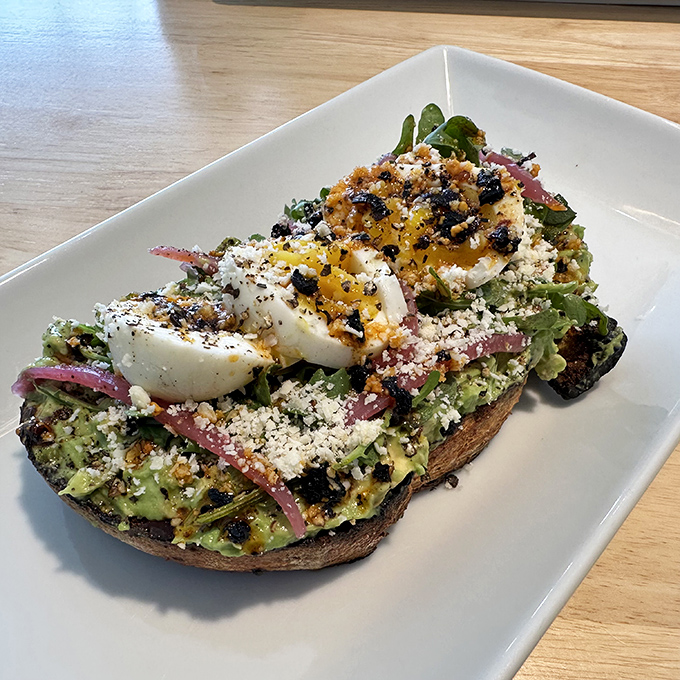 Avocado toast gets a gourmet makeover! This isn't your average millennial breakfast – it's a work of art on a plate.