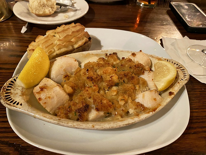 Baked scallops that look like they just took a dip in flavor heaven. Nestled in their shells, they're like little pearls of deliciousness waiting to be discovered.