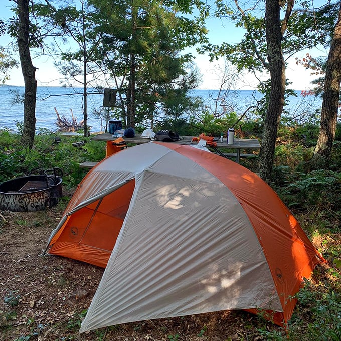 Lakeside camping: where "roughing it" means waking up to million-dollar views. S'mores taste better with a side of Superior, trust us.