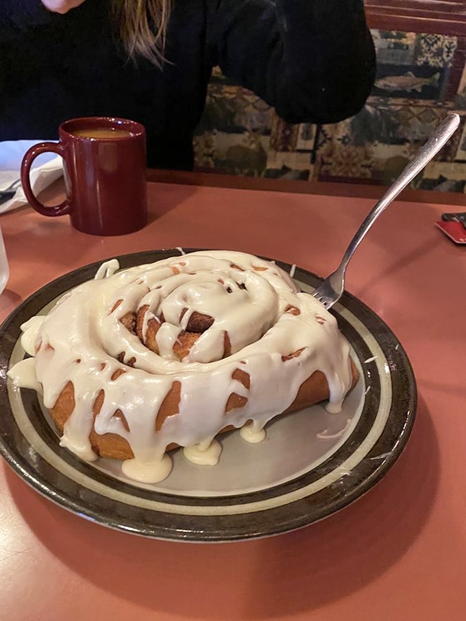This cinnamon roll isn't just dessert, it's a warm, gooey hug for your taste buds. Resistance is futile, just embrace the sweetness.